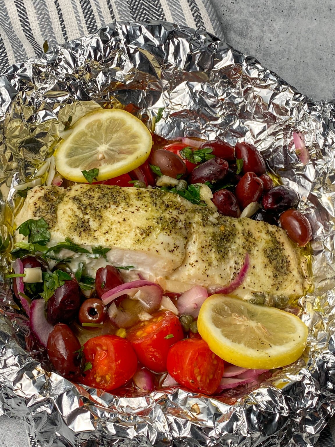 The Best Mediterranean Baked Fish in Foil Packets - The Tasteful Tribe
